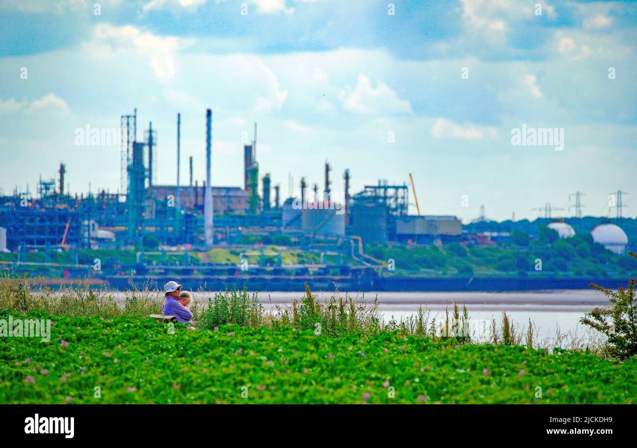 People sit and watch the wildlife across the River Mersey in Hale ...