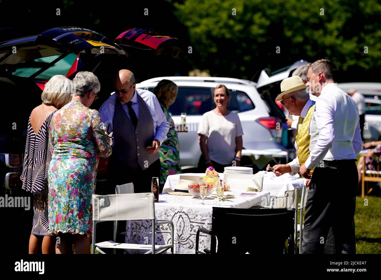 Racegoers enjoy drinks in a car park ahead of racing on day one of ...