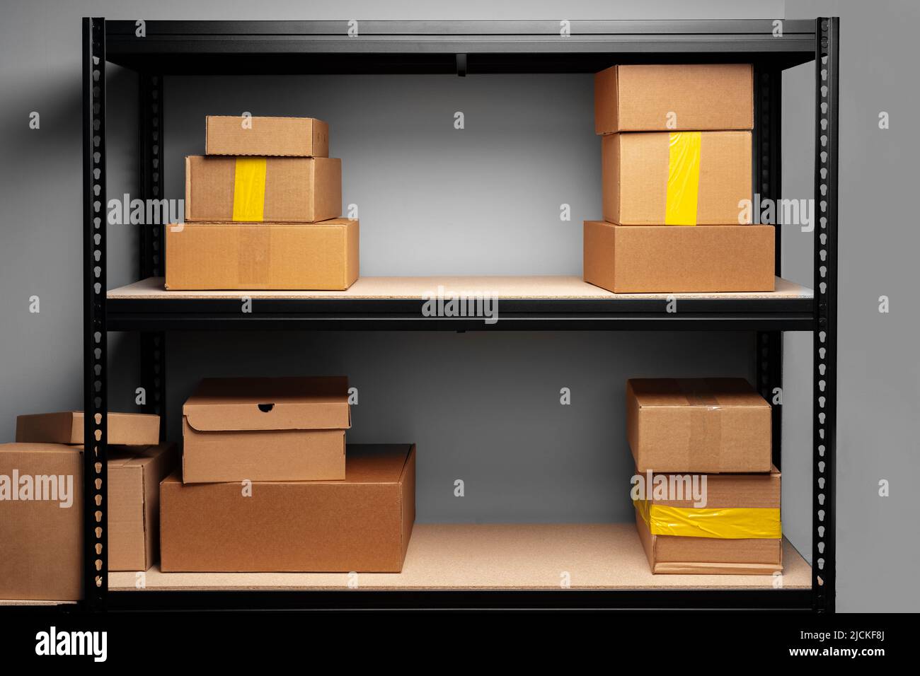 Rows of shelves with cardboard boxes in modern warehouse Stock Photo ...