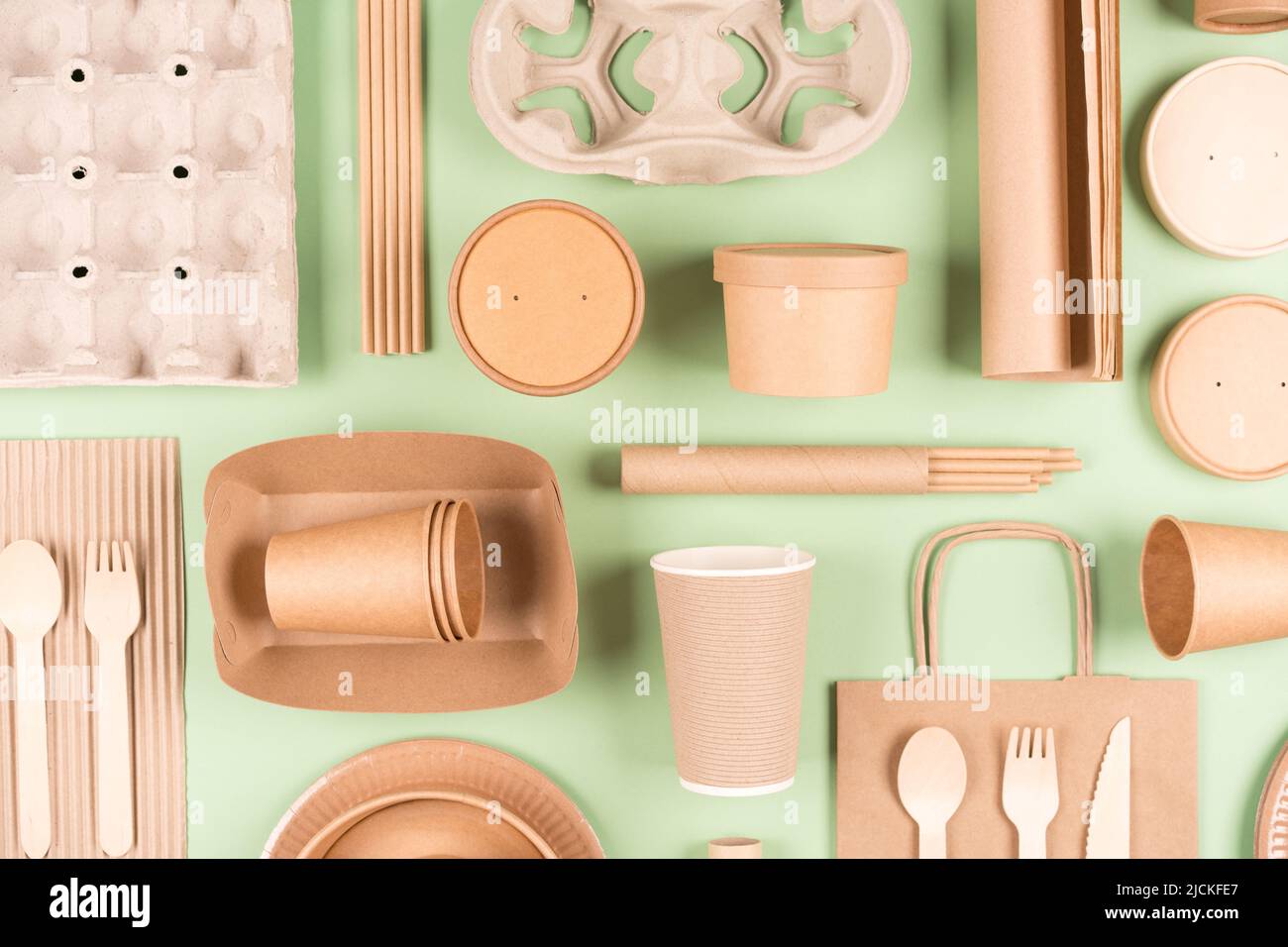 Eco tableware, paper utensils and wooden bamboo cutlery set over light ...