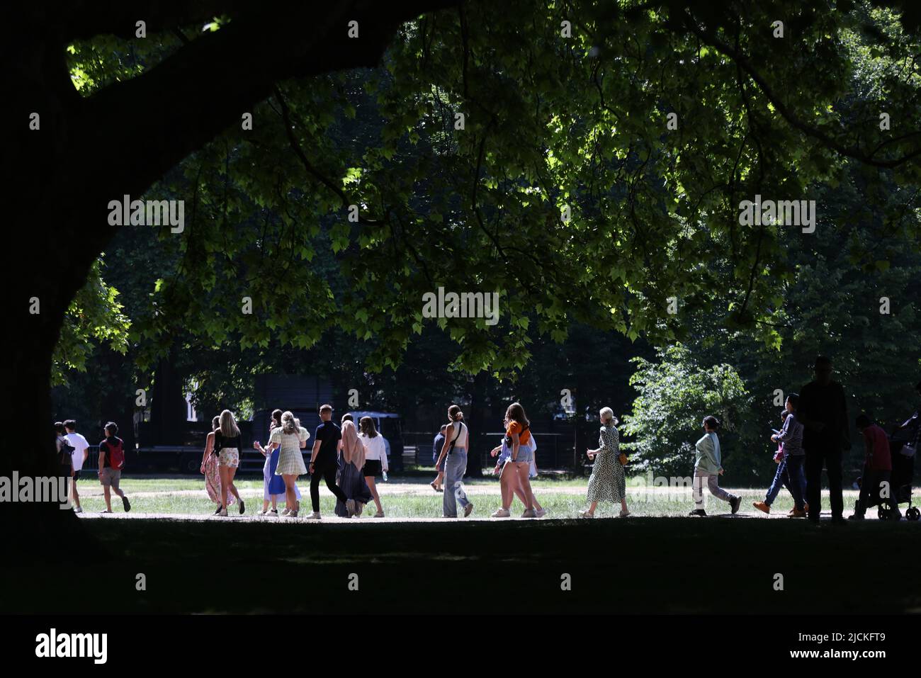 Members of the public walk through Green Park, central London during ...