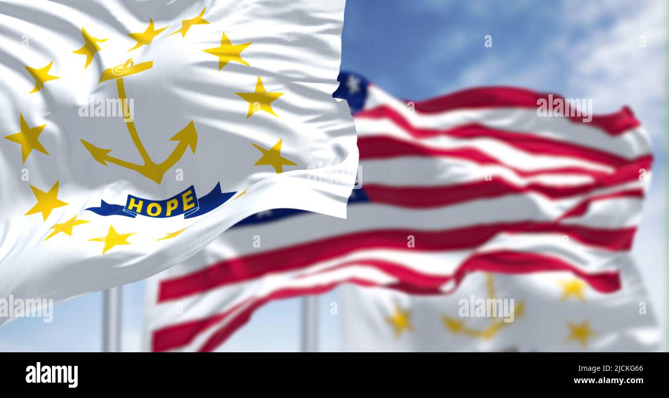 The Rhode Island state flag waving along with the national flag of the ...