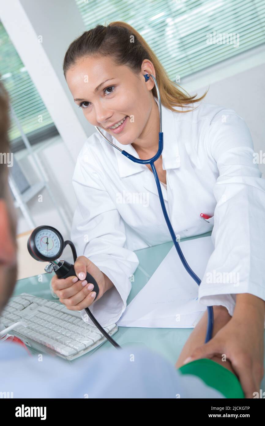 doctor taking pulse of the patient Stock Photo - Alamy