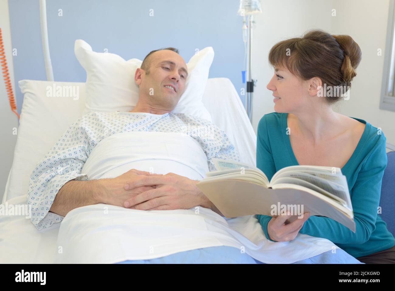 reading a book to a patient Stock Photo - Alamy