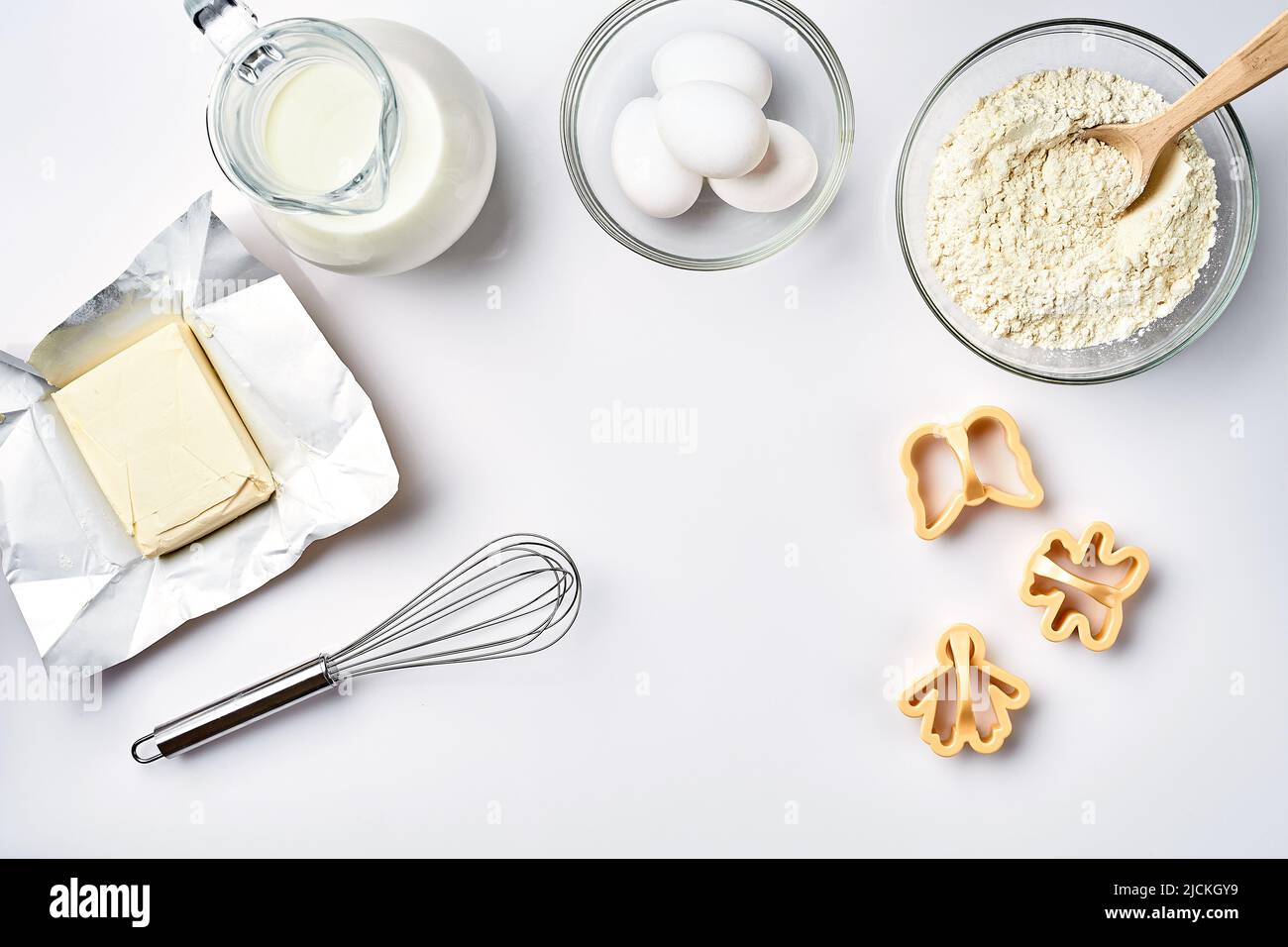 Objects and ingredients for baking, plastic molds for cookies on a ...