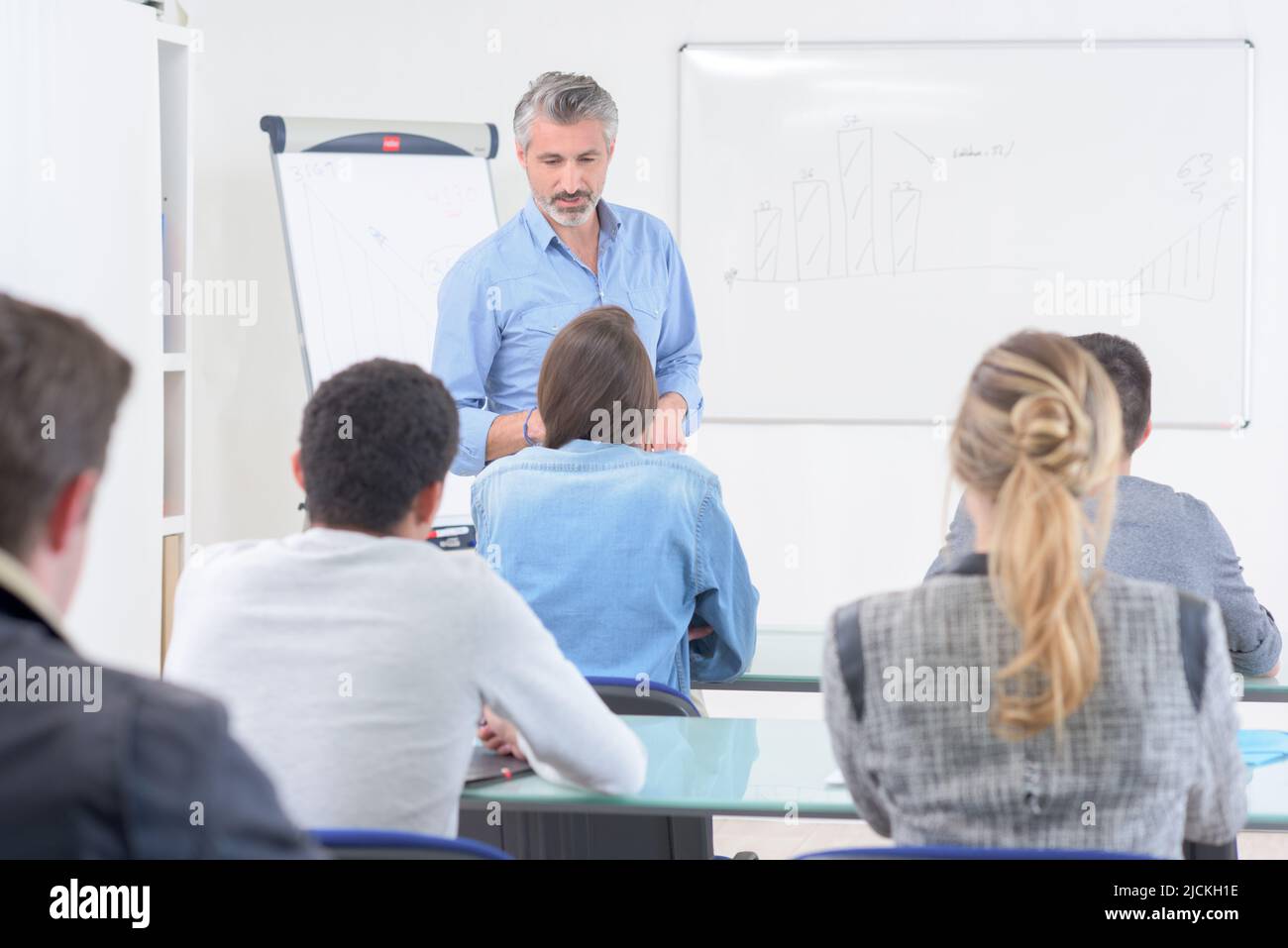 a teacher is giving a class Stock Photo - Alamy