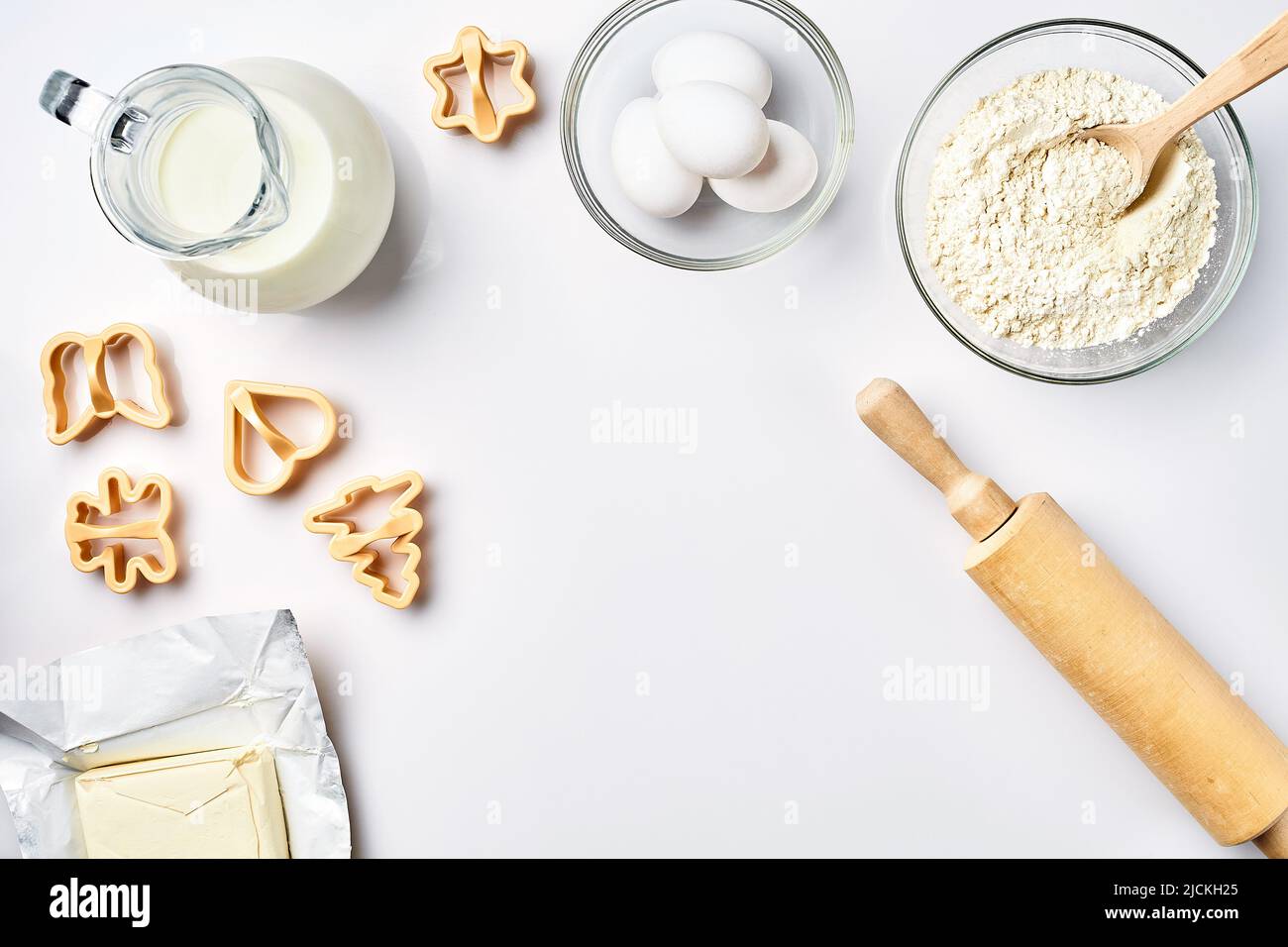 Objects and ingredients for baking, plastic molds for cookies on a ...