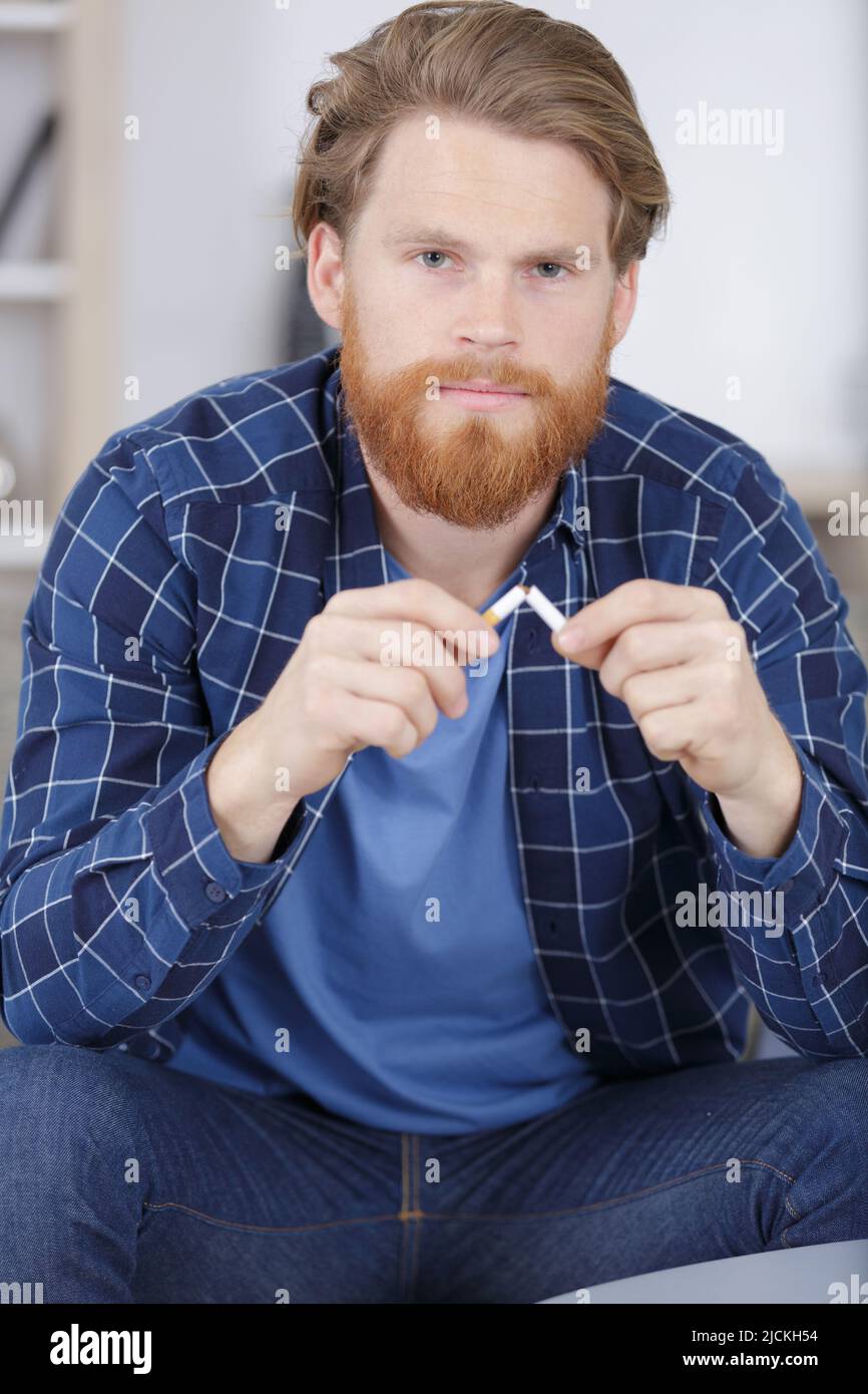 portrait of man trying to quit smoking Stock Photo - Alamy