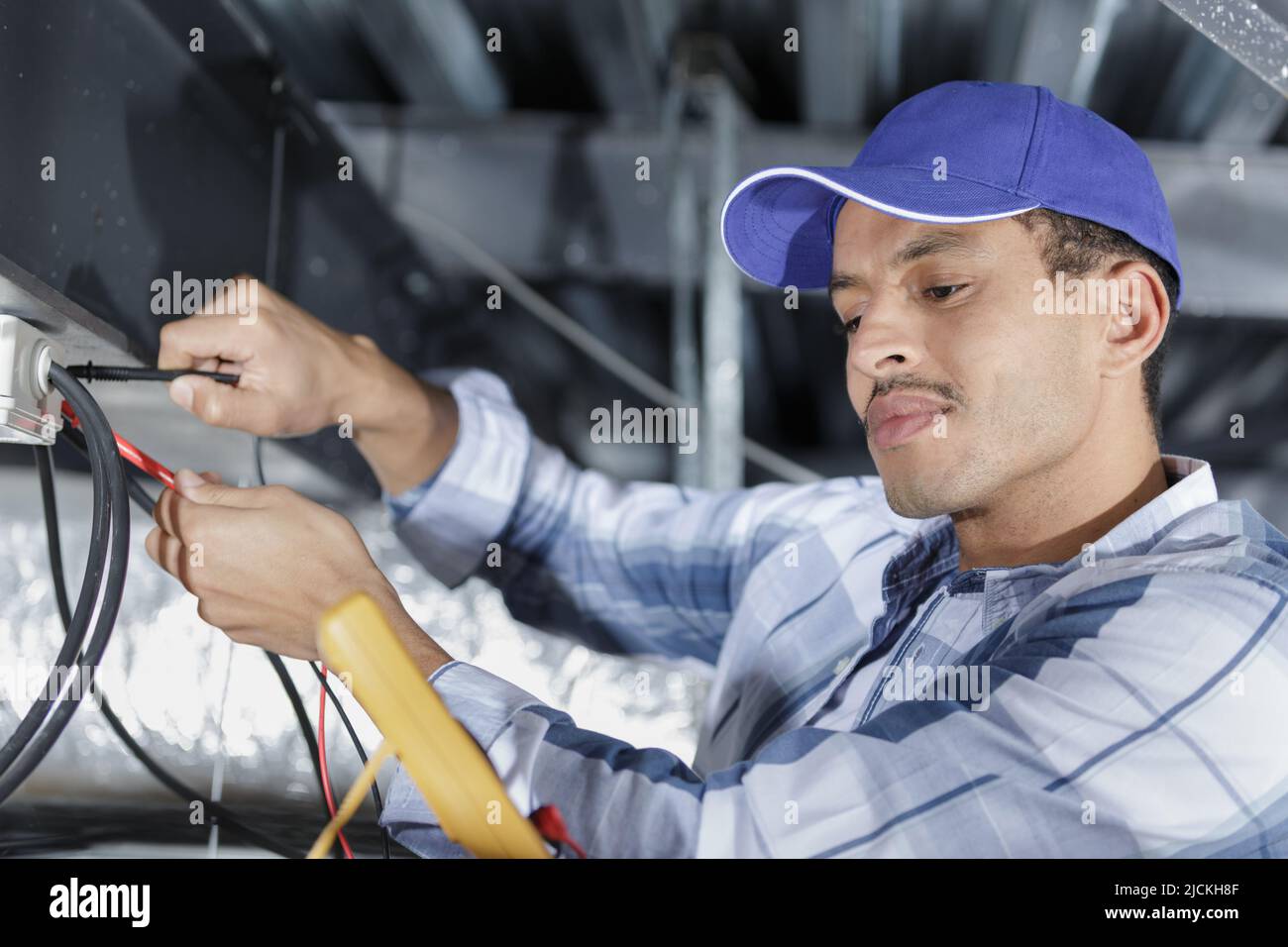 electrician before installing cables in roof Stock Photo - Alamy
