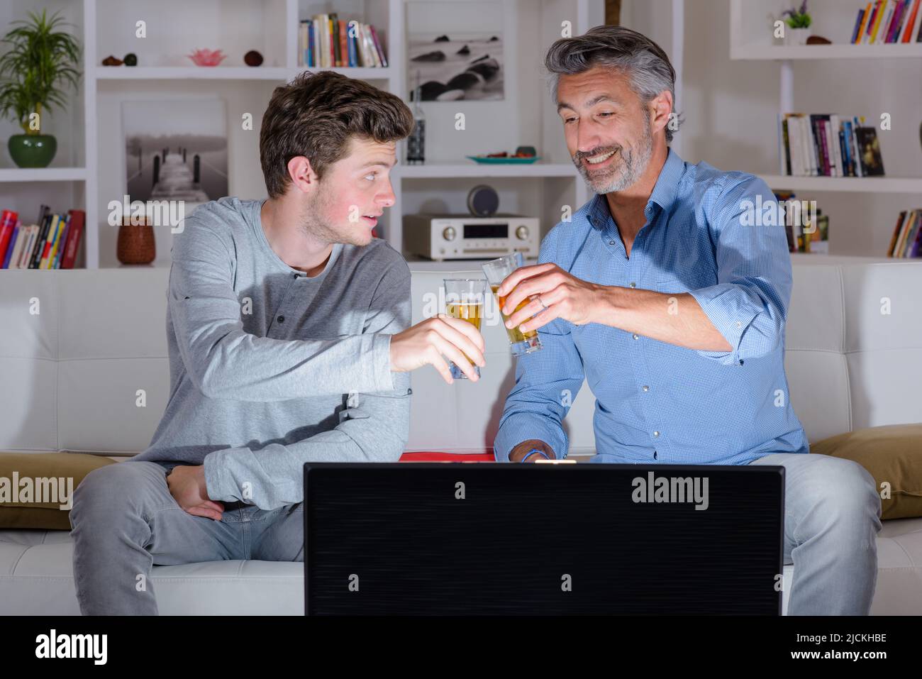 Father son cheers hi-res stock photography and images - Alamy