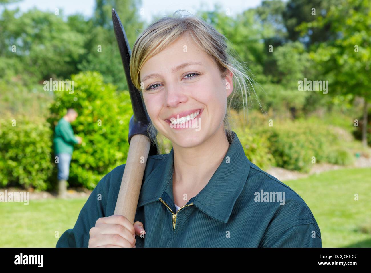 portrait of a smiling female gardener Stock Photo - Alamy