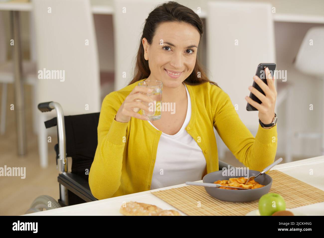 disable woman eating meatballs horizontal Stock Photo - Alamy