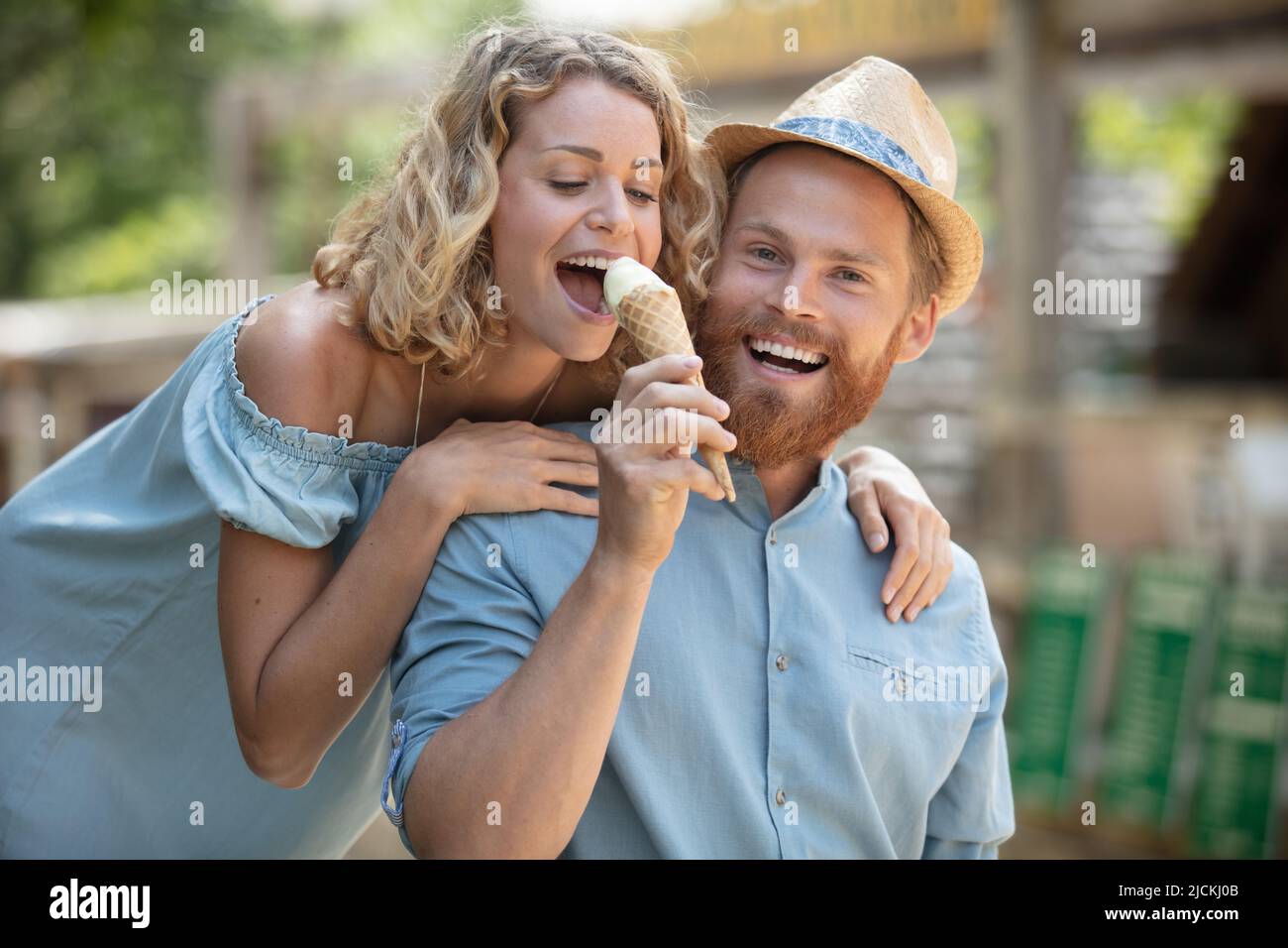 Smiling couple eating ice creams hi-res stock photography and images ...