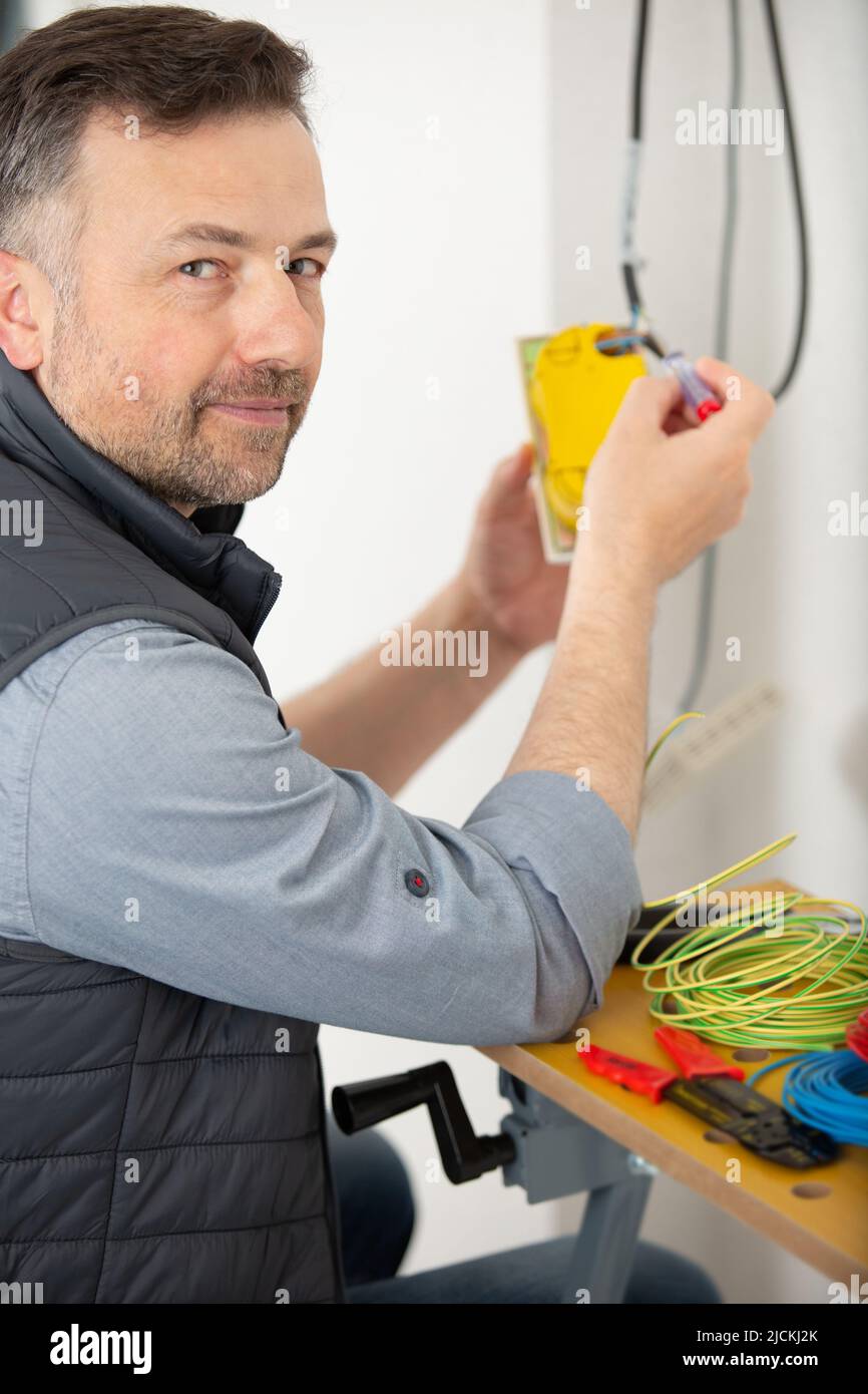 electrical worker wiring at construction site Stock Photo - Alamy