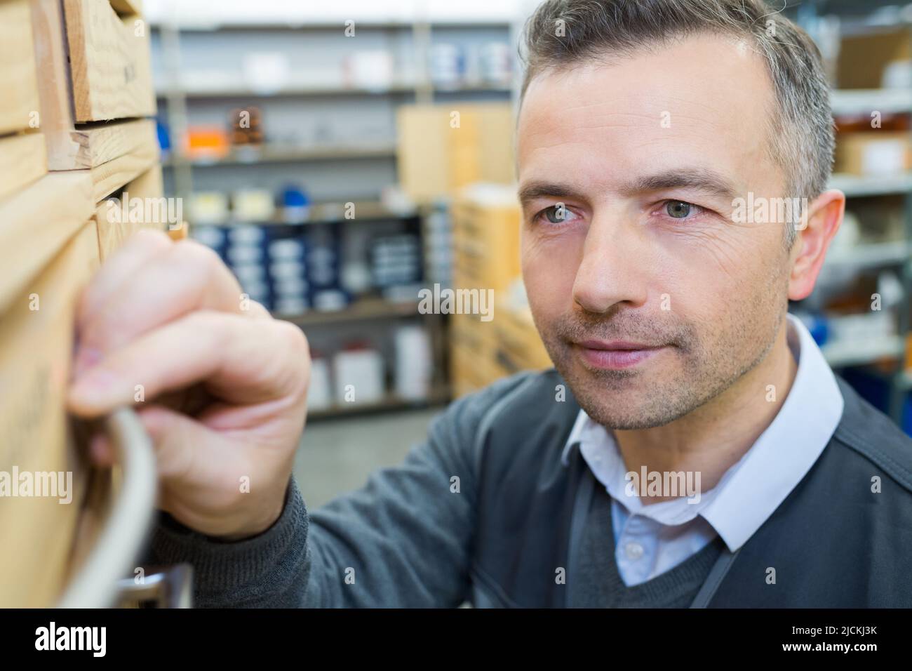 industrial woodworking designer inspecting drawer Stock Photo - Alamy