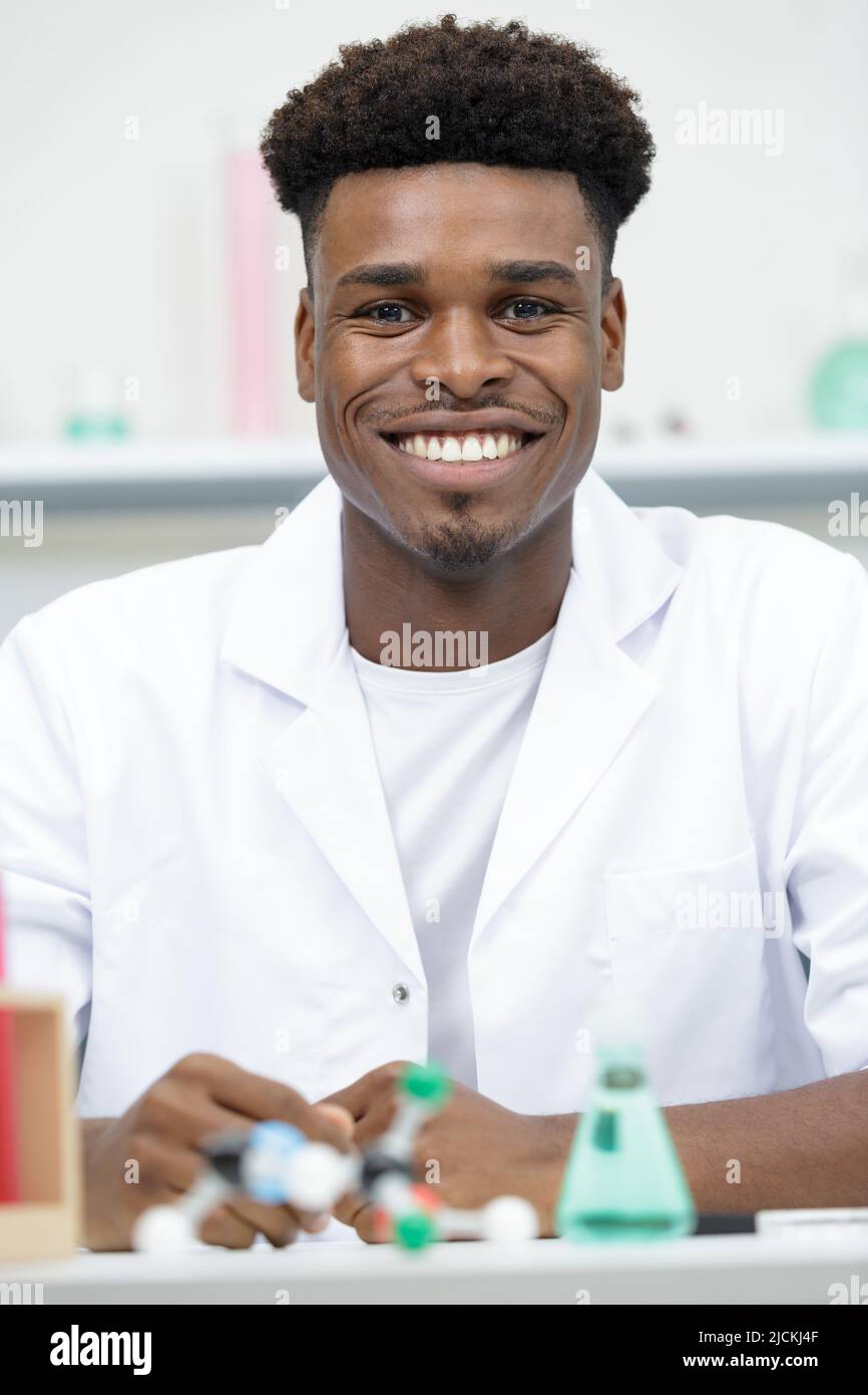 portrait of cheerful handsome scientist looking at camera Stock Photo ...