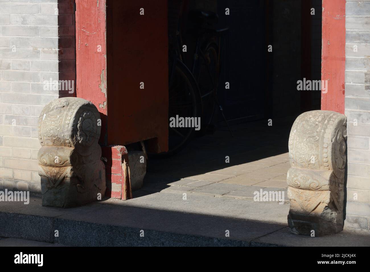 Stone carvings at the gate of the old quadrangle siheyuan in Beijing ...