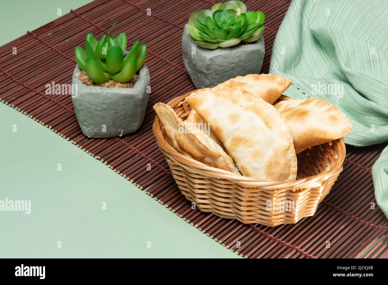 portion of bar meat pastries in a green background Stock Photo - Alamy