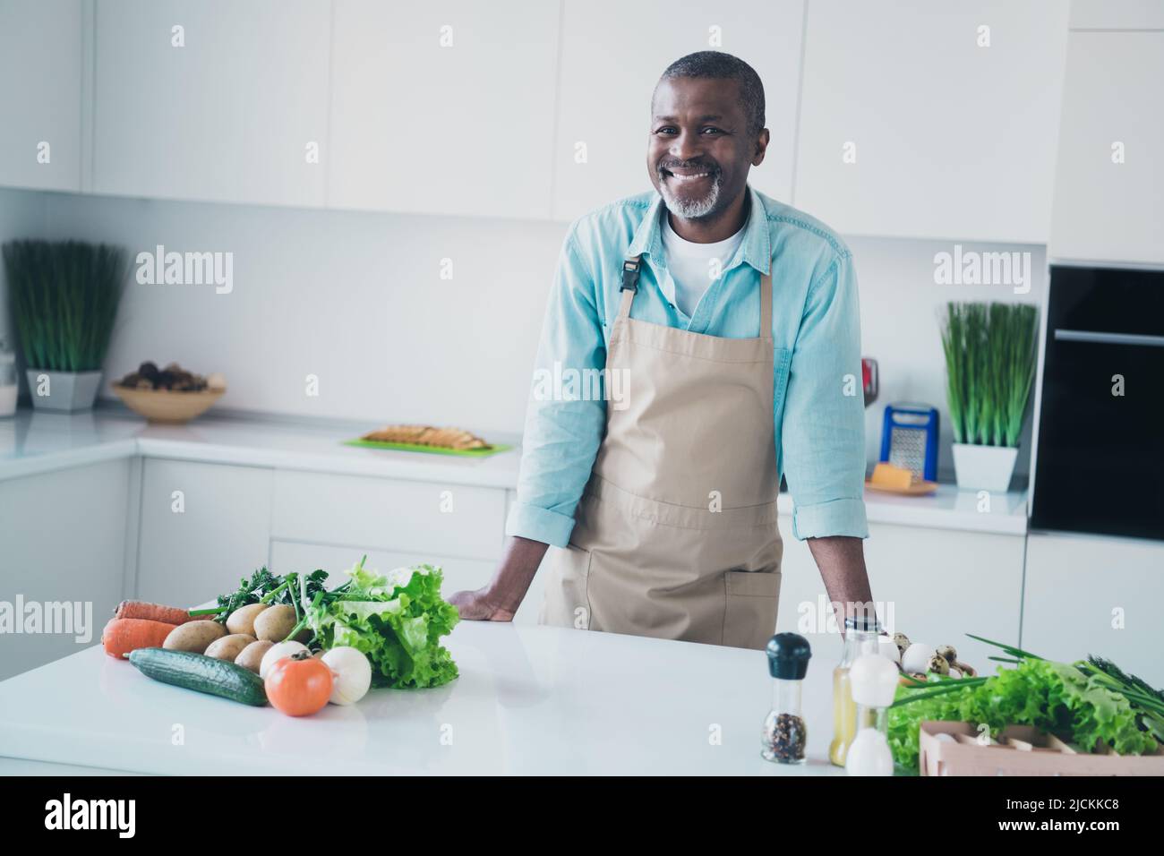 Photo of handsome attractive mature guy cooking healthy breakfast ...