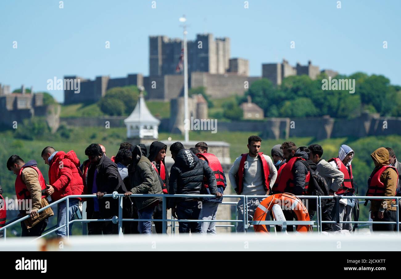 A group of people thought to be migrants are brought in to Dover, Kent ...