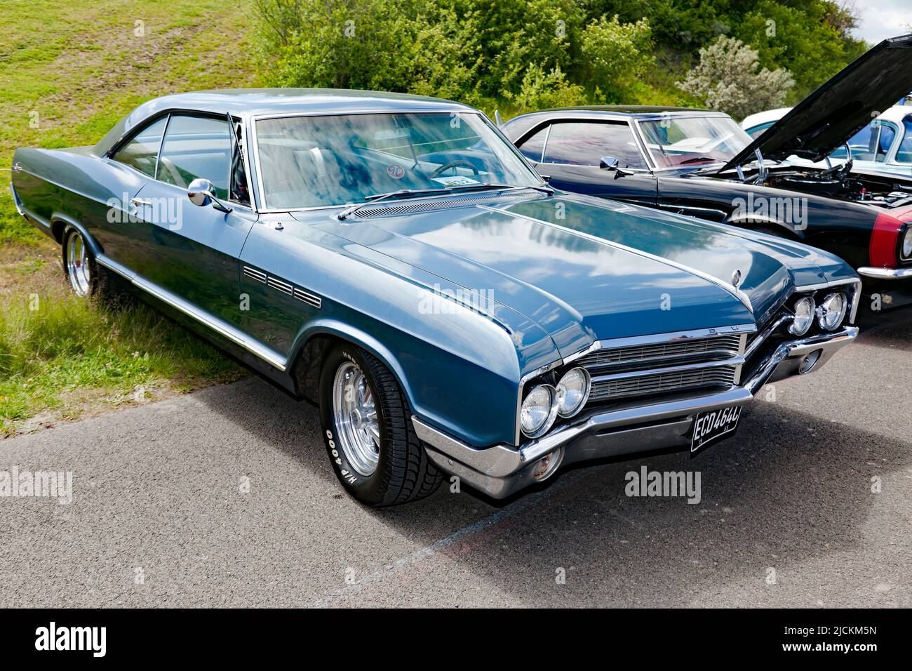 Three-quarters front view of a Second Generation, Blue, 1965, Buick Le ...