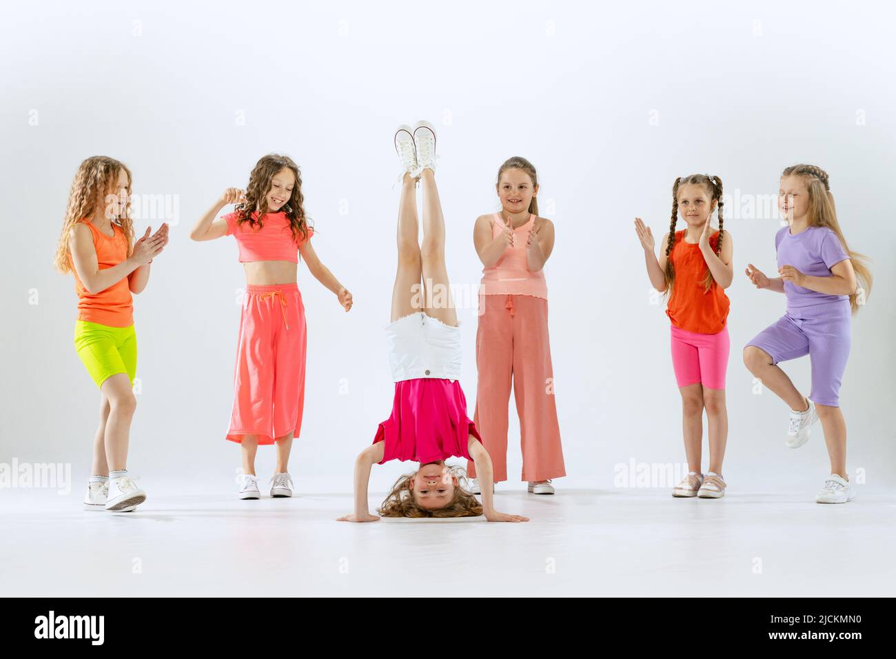 Portrait of happy, active little girls, happy kids in bright colorful ...