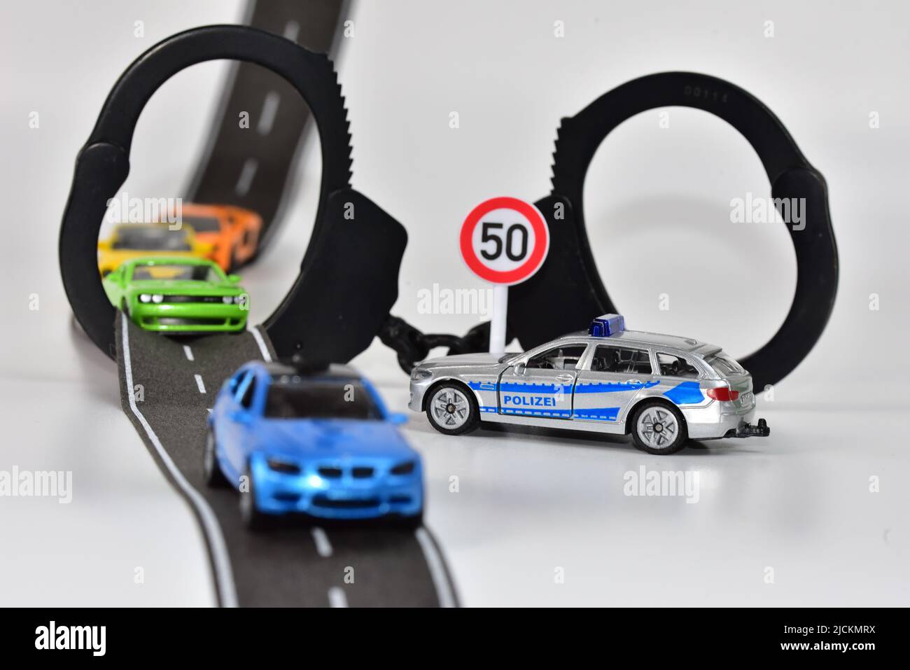 Man handcuffed police car hi-res stock photography and images - Alamy