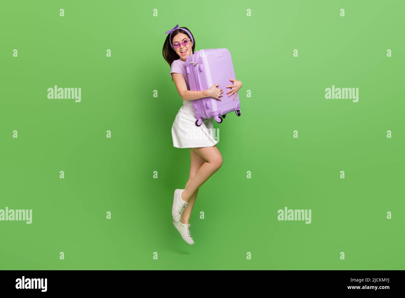 Full size photo of impressed brunette lady jump hold bag wear head band ...