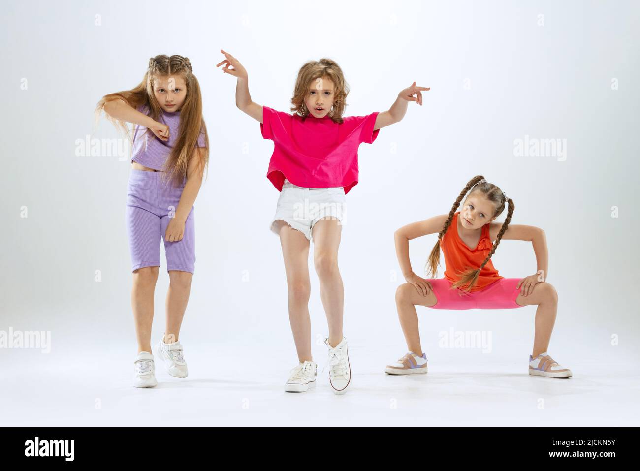 Portrait of happy, active little girls, happy kids in bright colorful ...