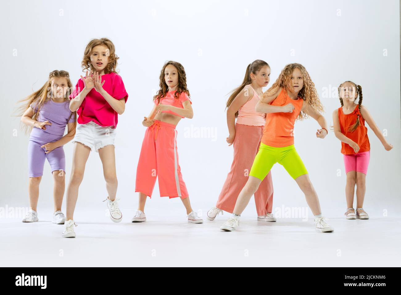 Portrait of happy, active little girls, happy kids in bright colorful ...