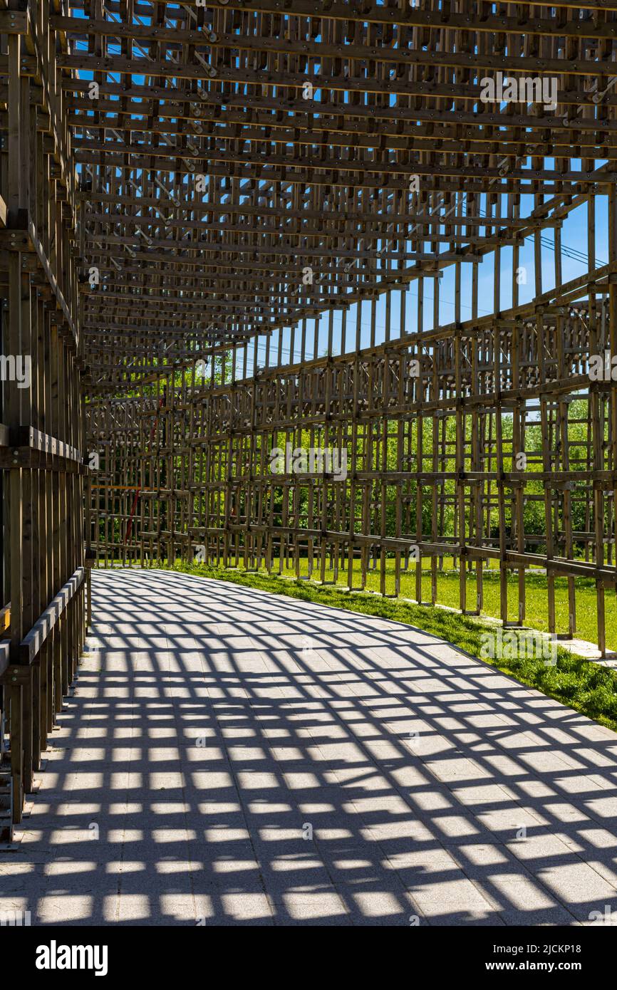passage in the park protected by a wooden cage. High quality photo ...
