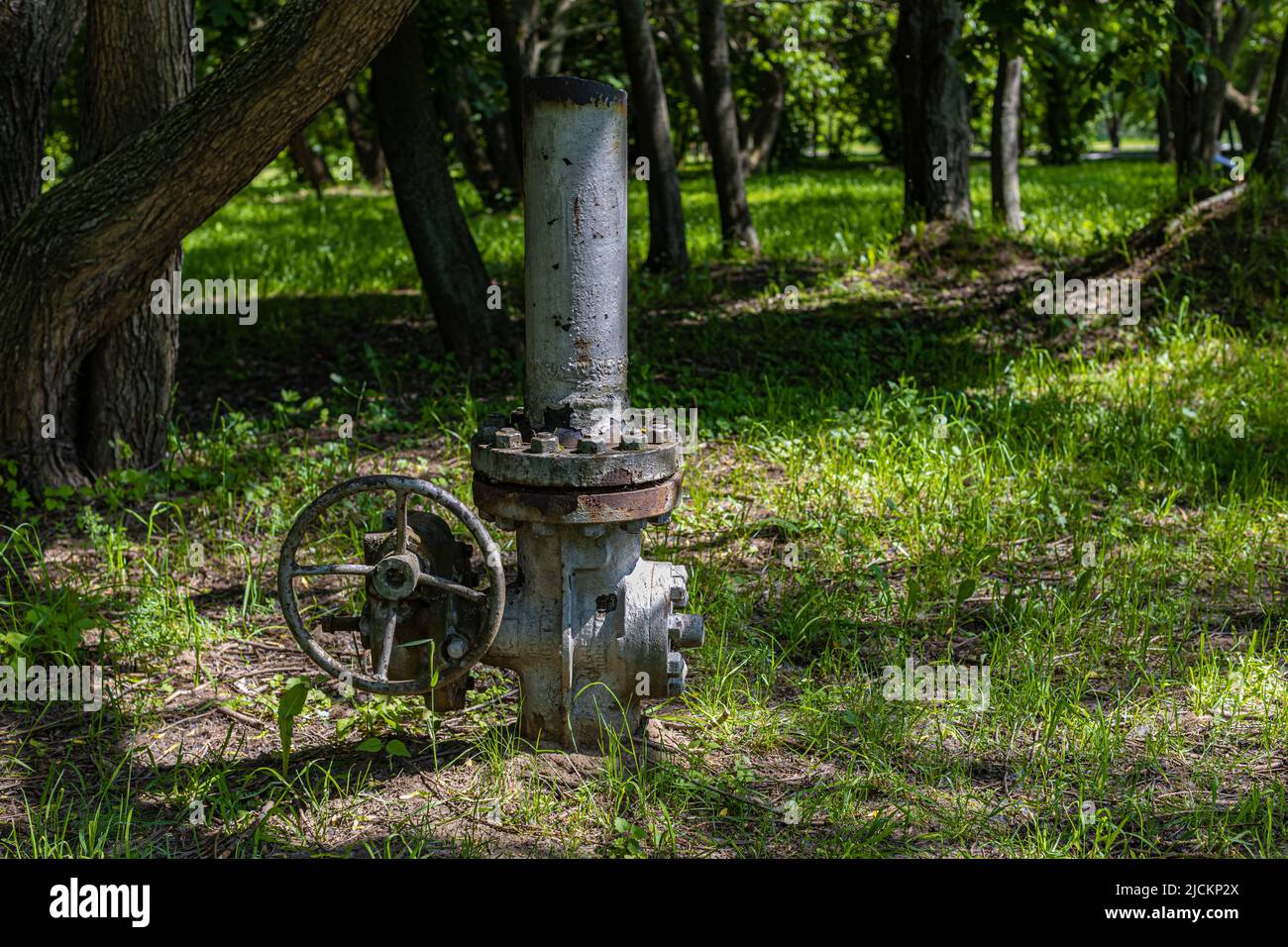 water supply tap installed in the well in the park. High quality photo ...
