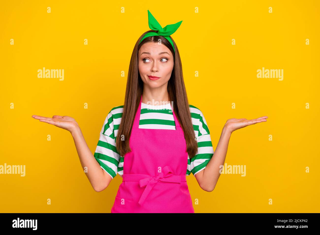 Portrait of doubtful person look hands demonstrate empty space scales ...