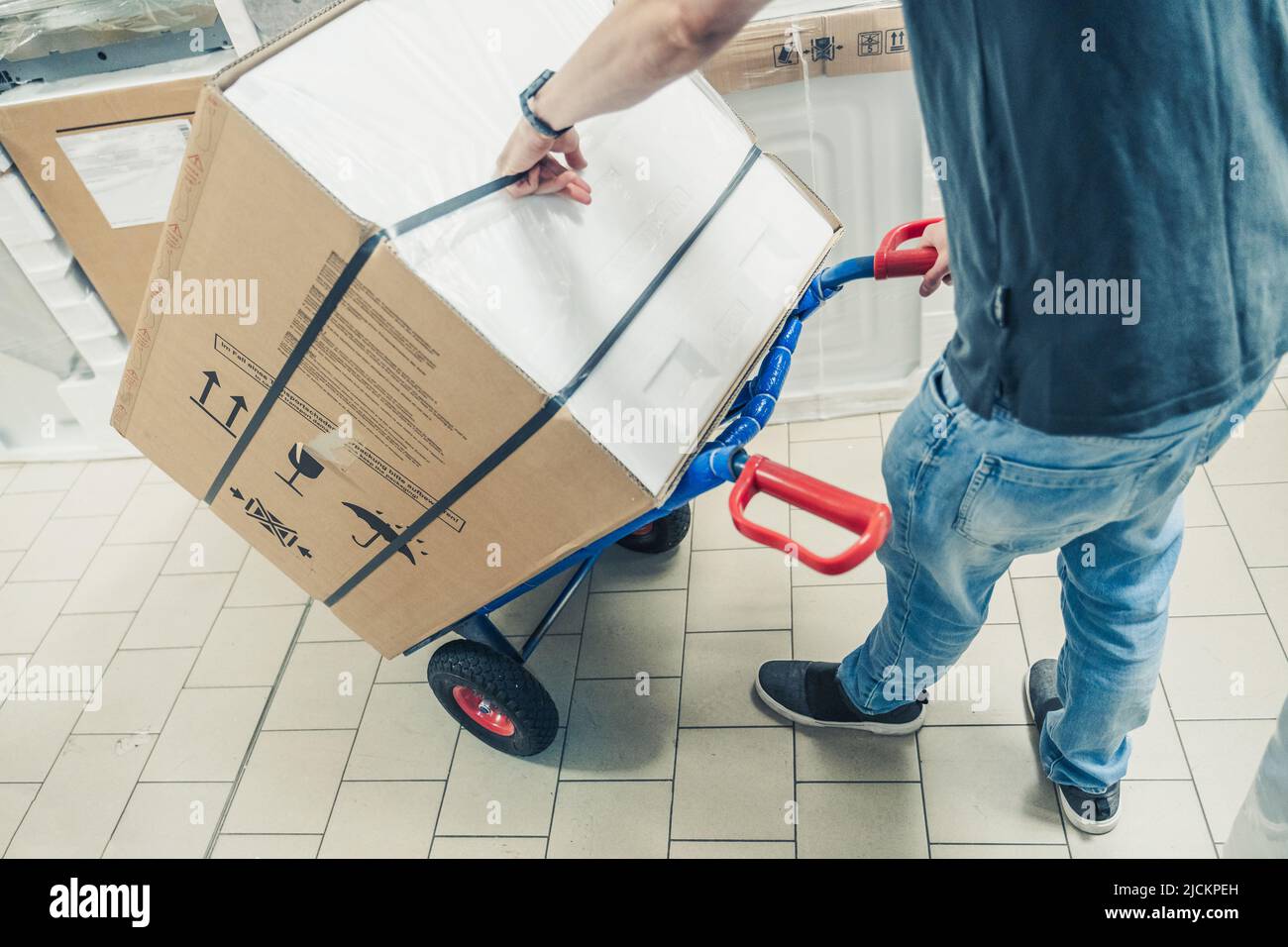Loading in refrigerator hi-res stock photography and images - Alamy