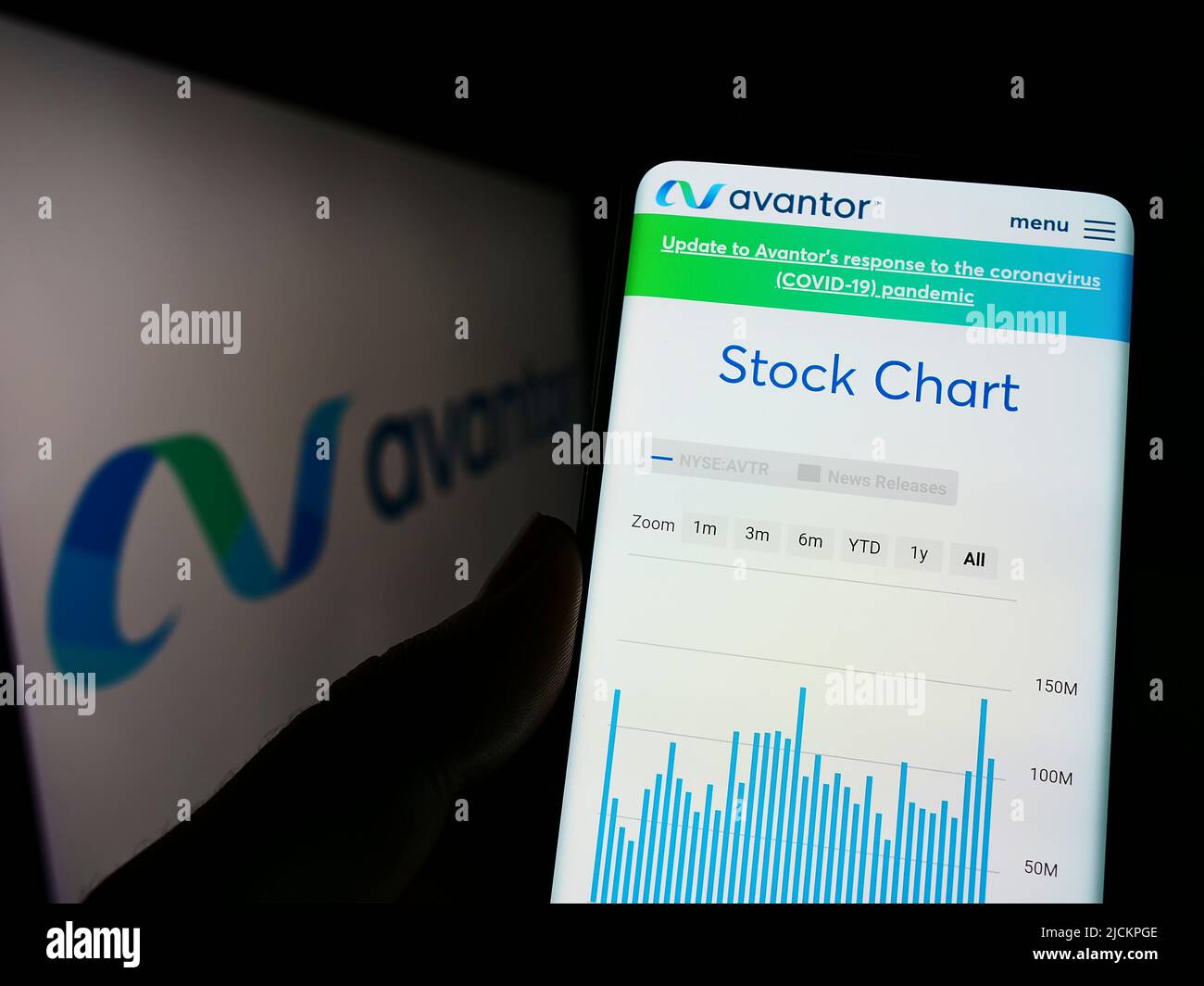 Person holding cellphone with webpage of US chemicals company Avantor ...