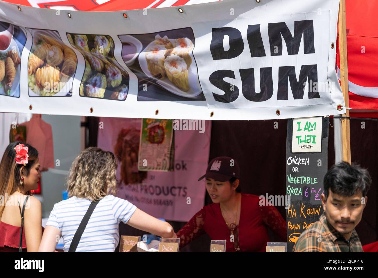 People buying Thai food at a Dim Sum stall at the Magic of Thailand ...