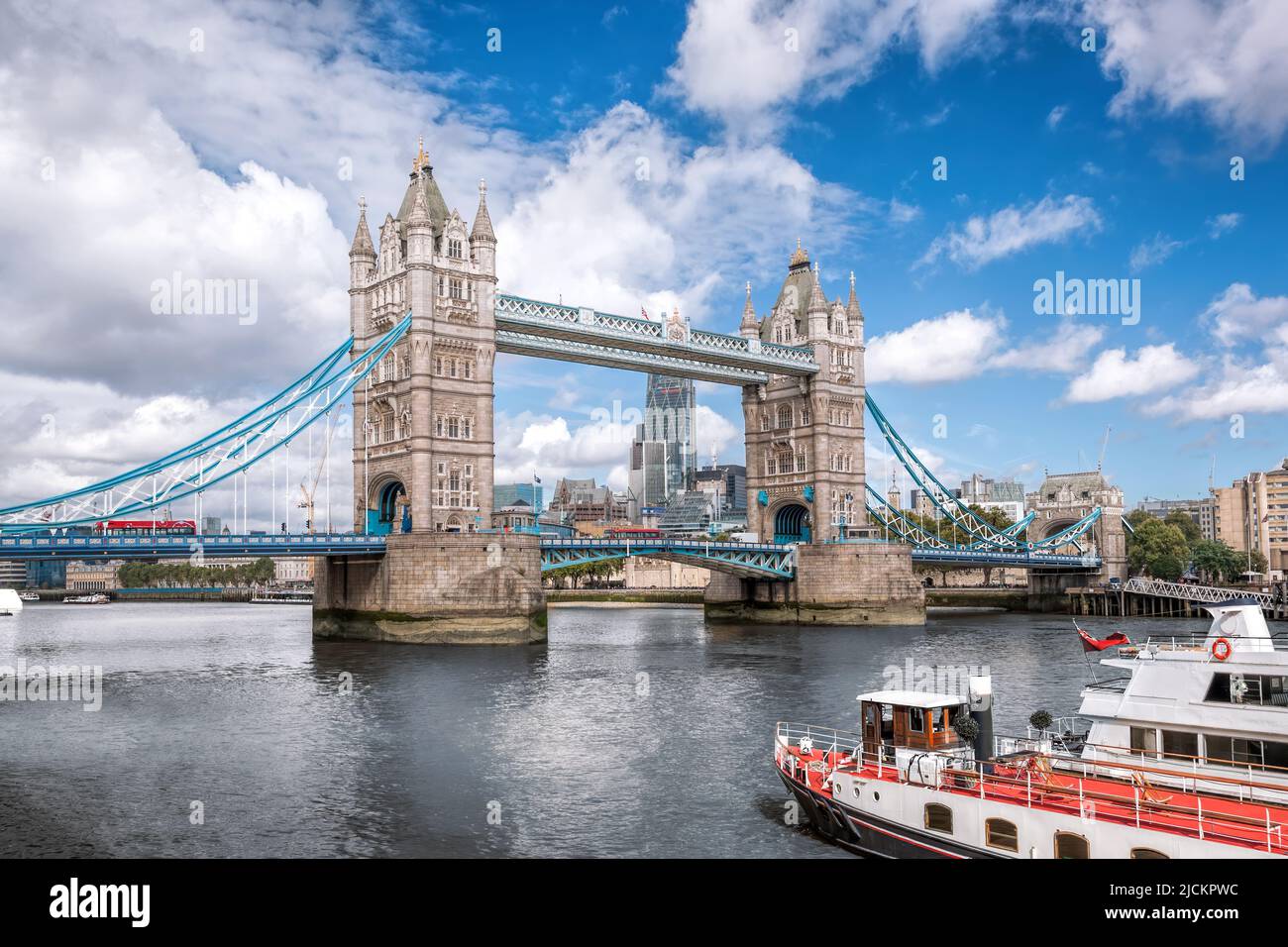Tower Bridge with tourist boat in London, England, UK Stock Photo - Alamy