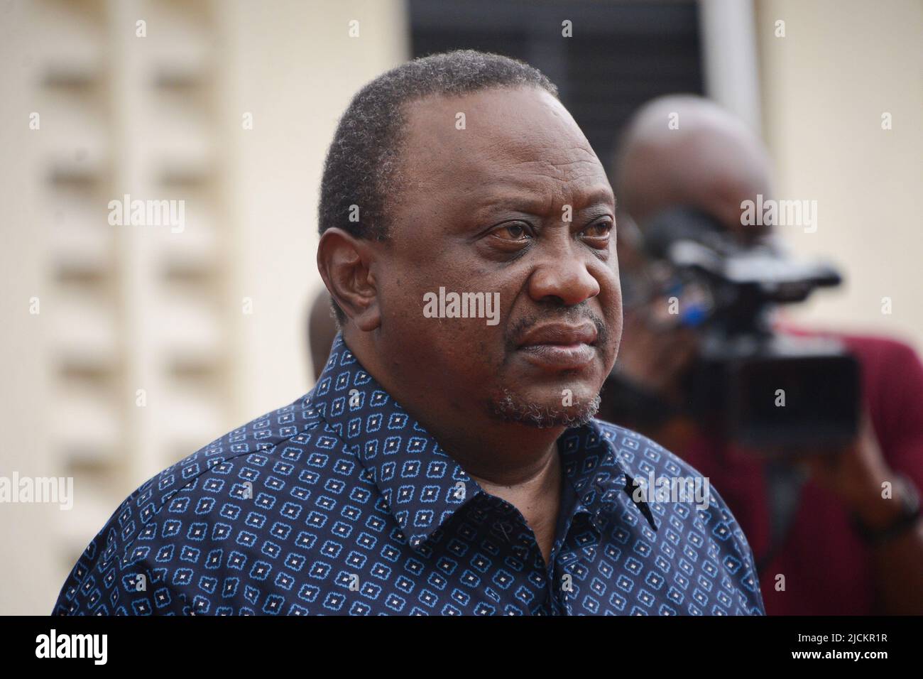 President Uhuru Kenyatta stands still as the national anthem of Kenya ...