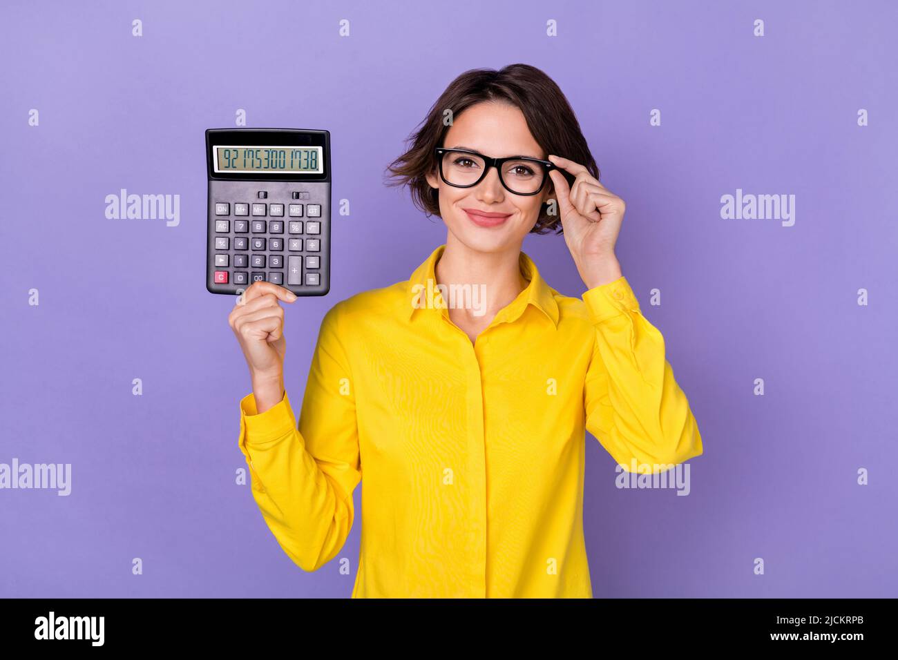 Photo of nice young lady hold calculator wear yellow outfit eyewear ...