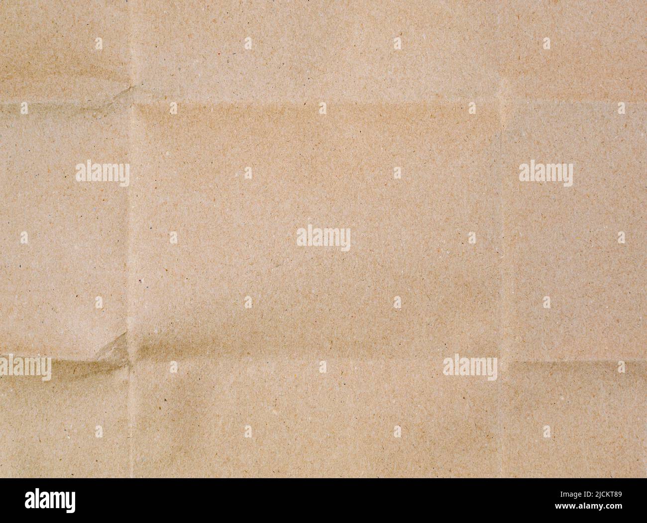 The surface of beige wrapping craft paper with wrinkled lines and ...