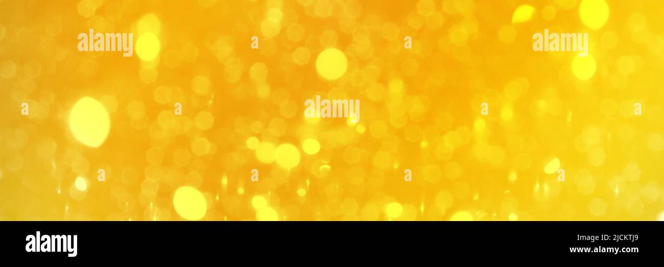 Bright yellow sparkling glitter bokeh background, banner texture ...