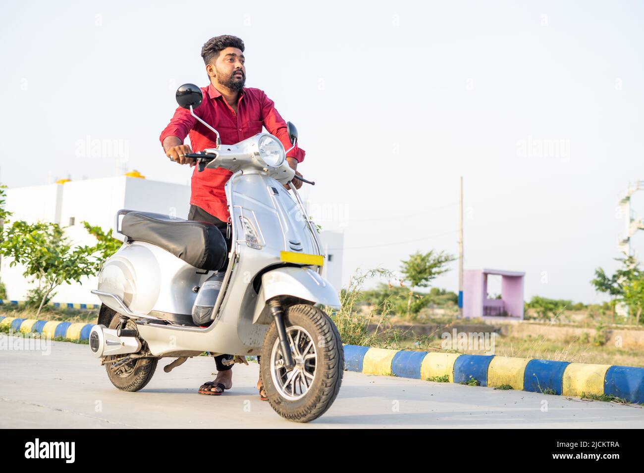 Man pushing electric bike hi-res stock photography and images - Alamy