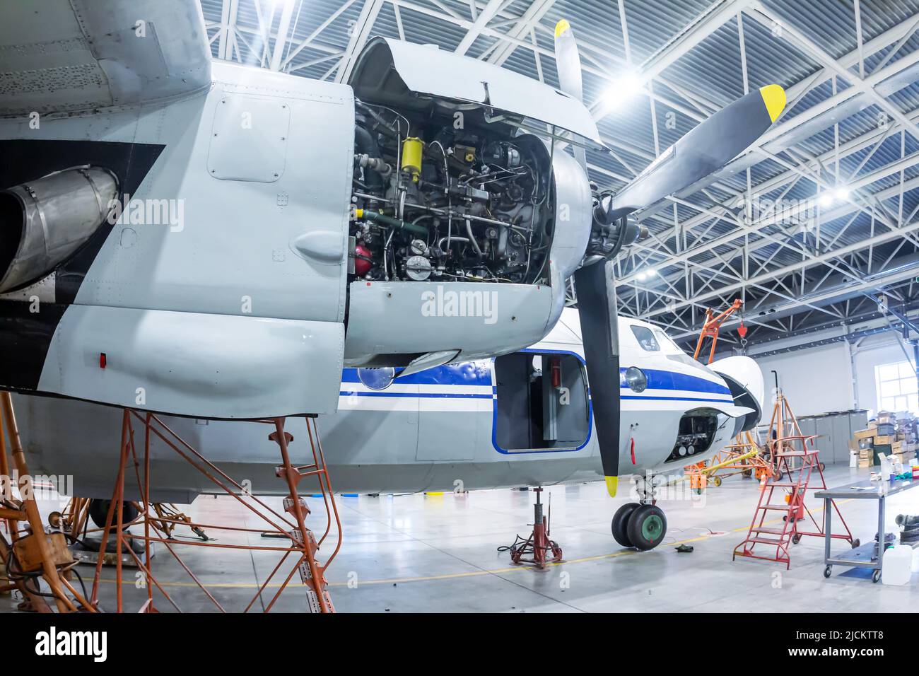 Transport turboprop aircraft in the hangar. Close-up of an open ...