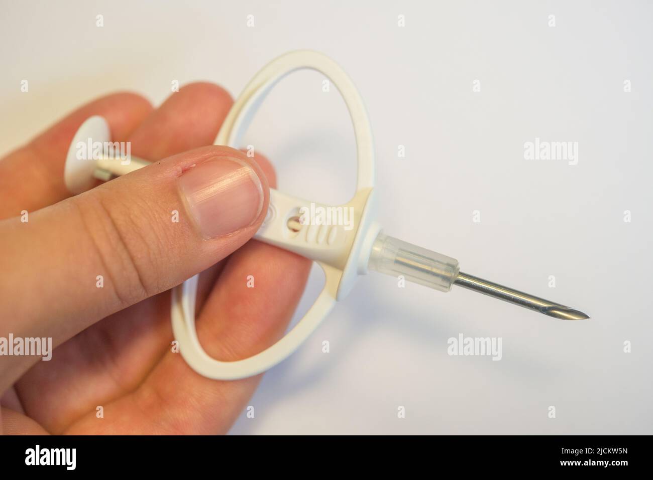 Instrument for inserting microchip under dog's skin Stock Photo - Alamy