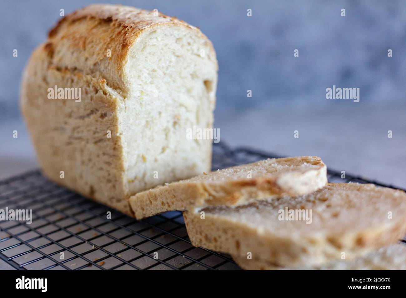 Baked Ruddy Wheat Brick Bread sourdough and slice with flax seeds on a ...