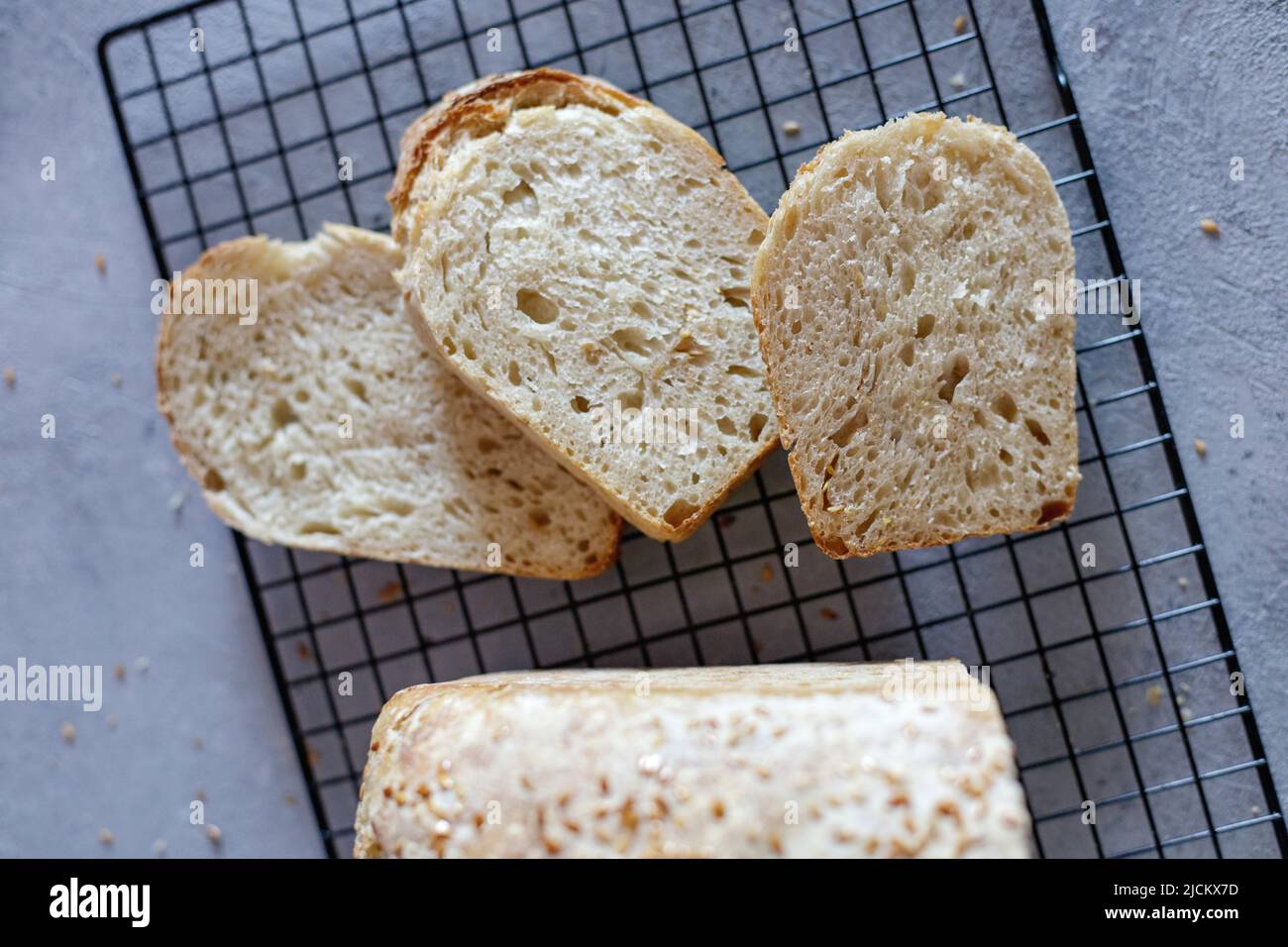 Baked Ruddy Wheat Brick Bread sourdough and slice with flax seeds on a ...