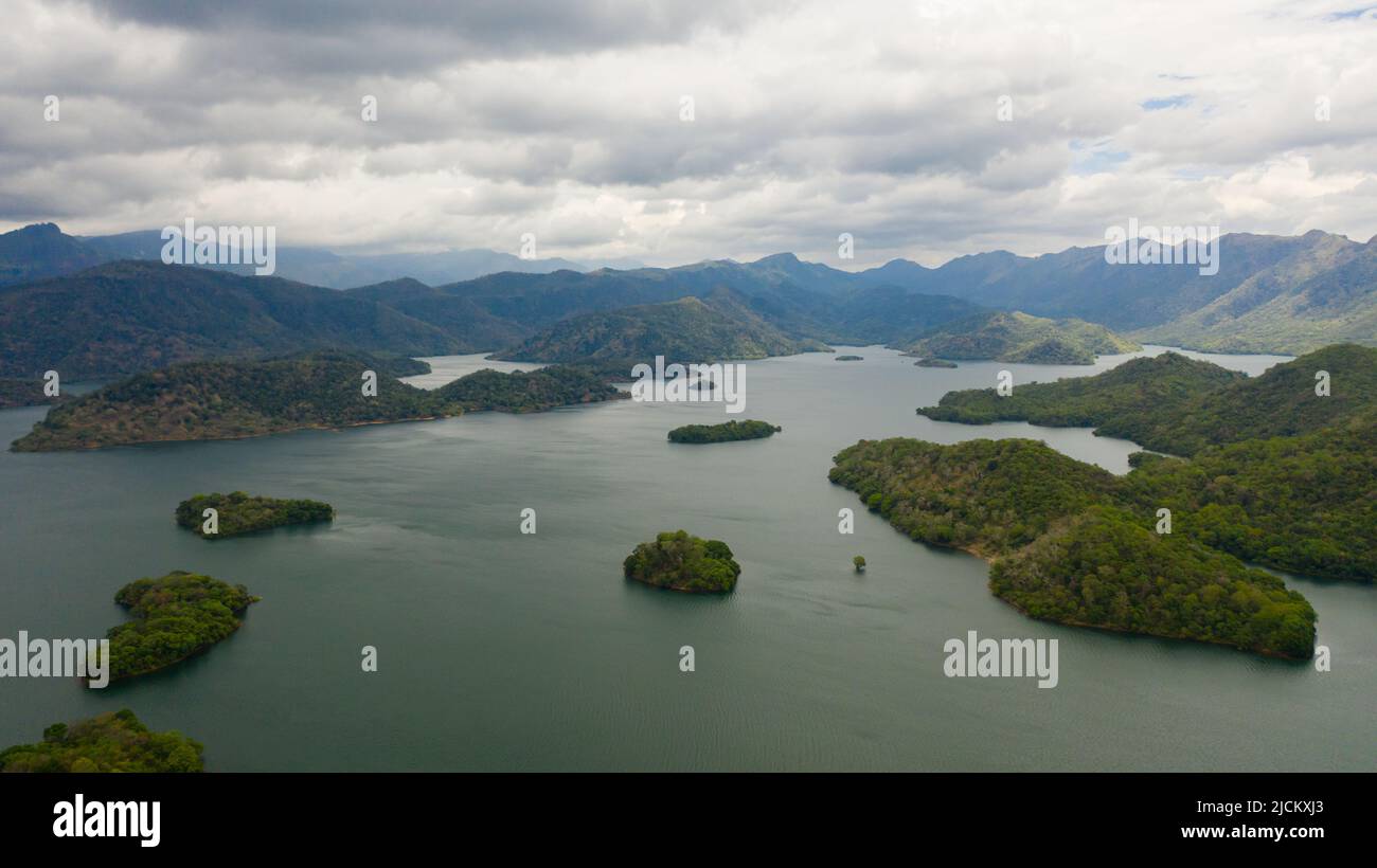 Aerial drone of Lake among the mountains covered with jungle. Sri Lanka ...