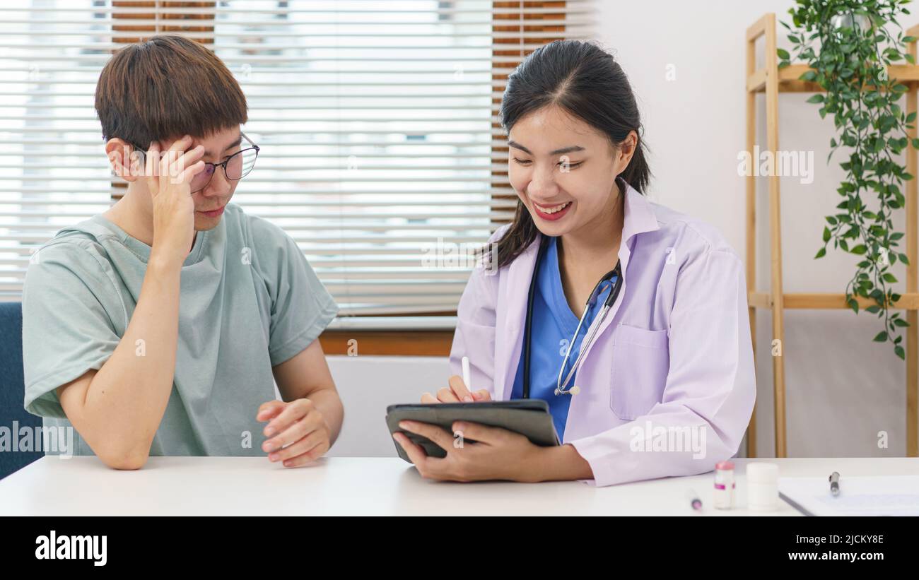 Healthcare concept, Male patient feeling headache and talk with doctor ...