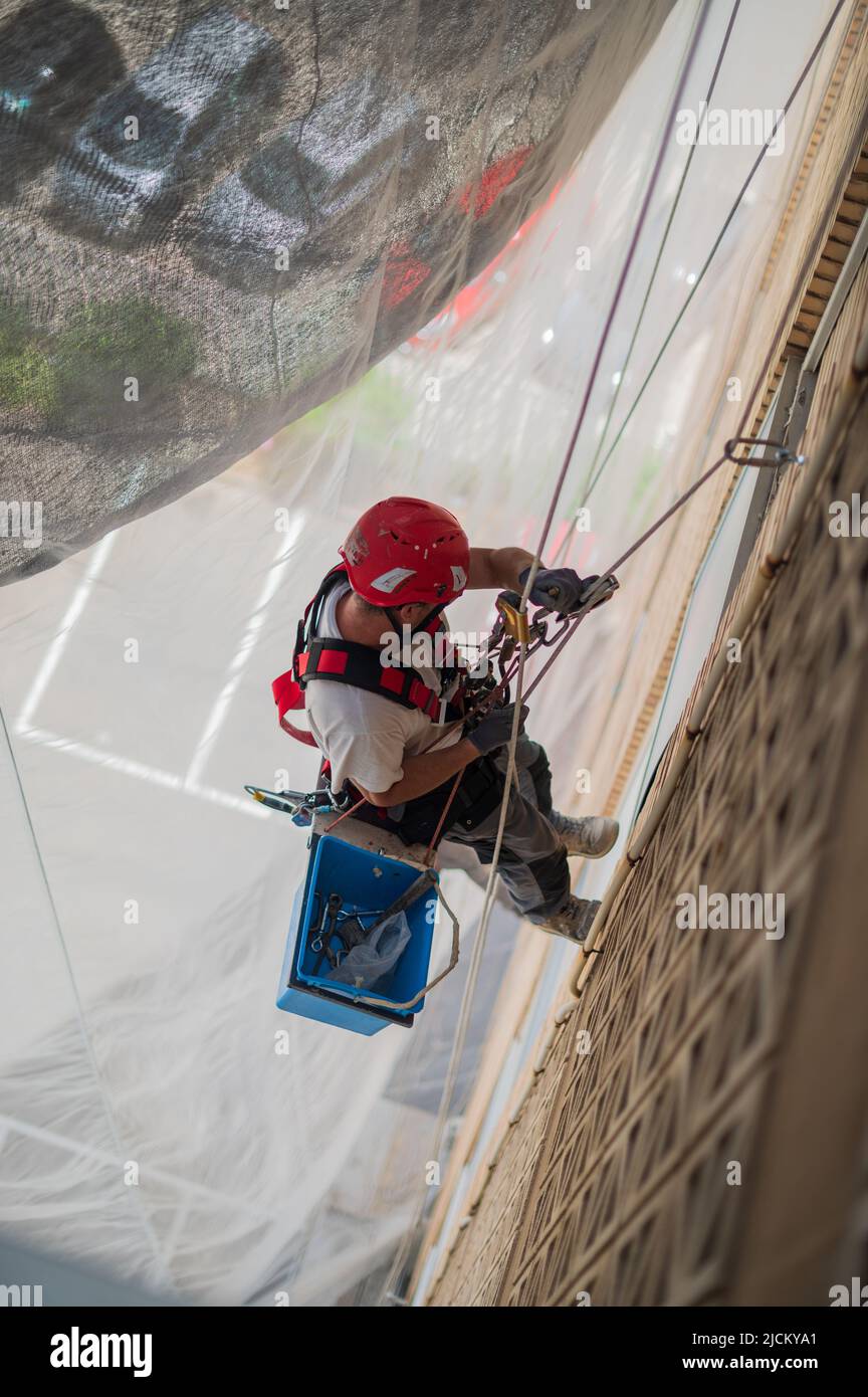 Industrial climbers at work in residential building Stock Photo - Alamy