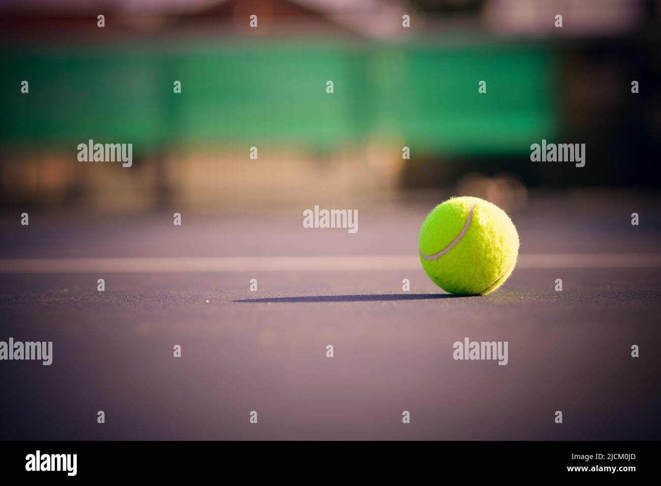 tennis ball on ground Stock Photo - Alamy